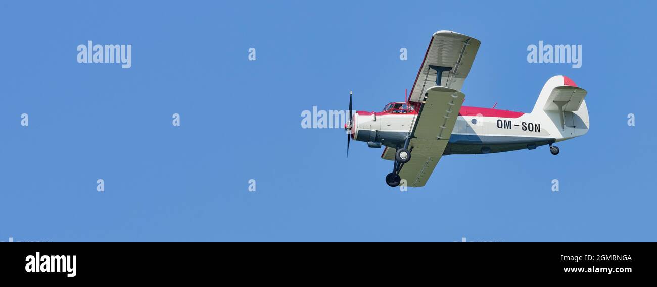 Light aerobatic biplane in close flight Stock Photo - Alamy