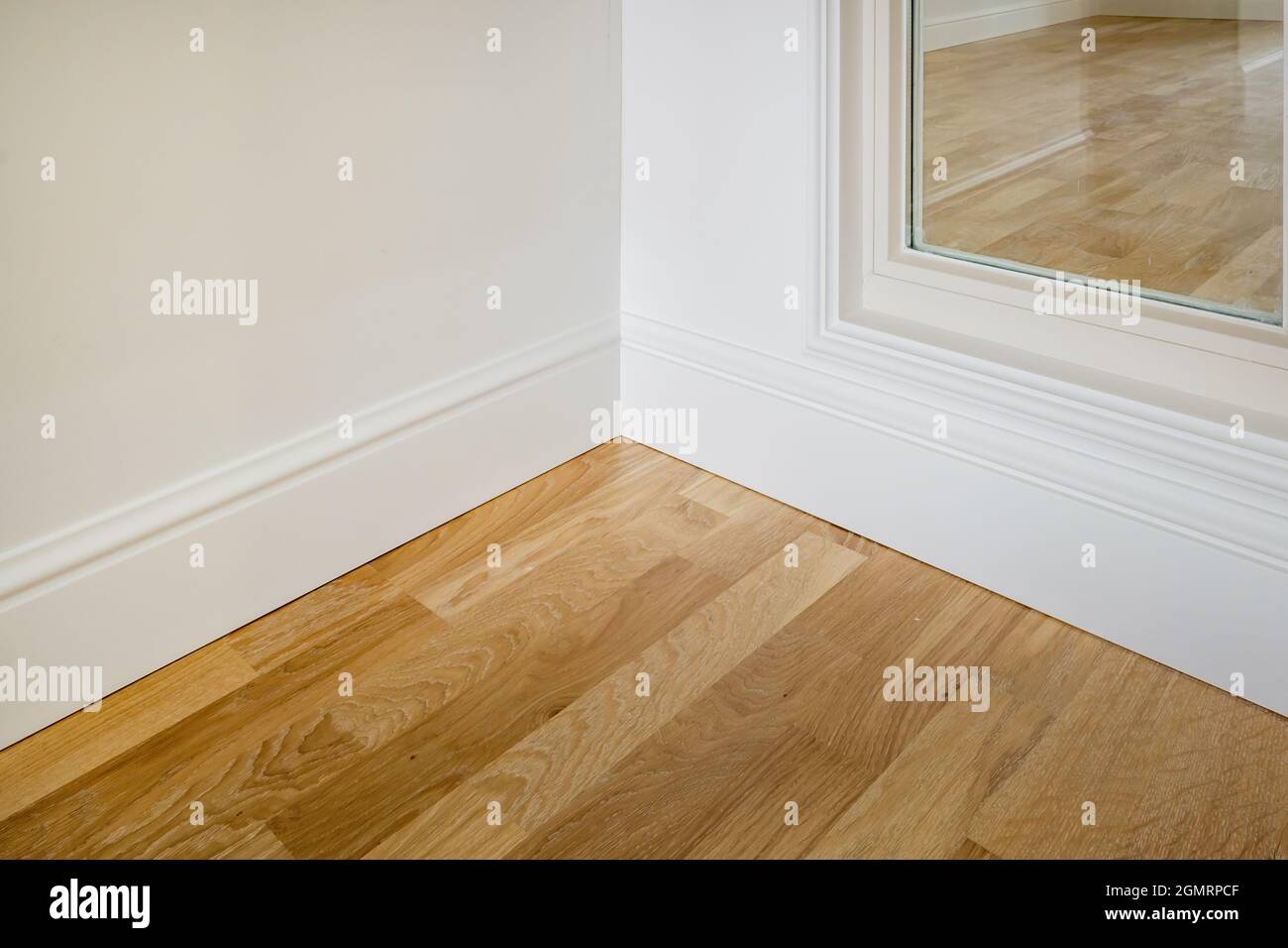 Detail of corner flooring with intricate crown molding and plinth Stock ...