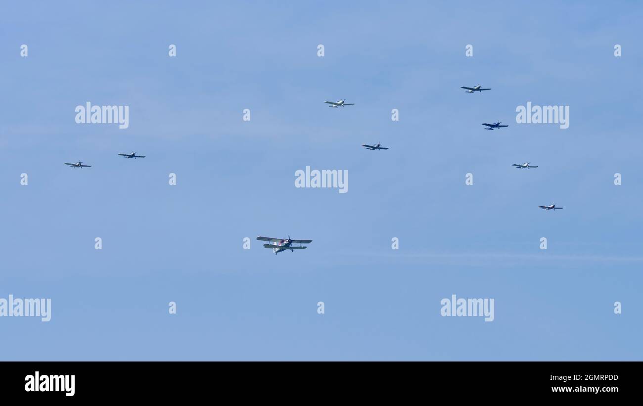 A group of light aerobatic aircraft is approaching Stock Photo - Alamy