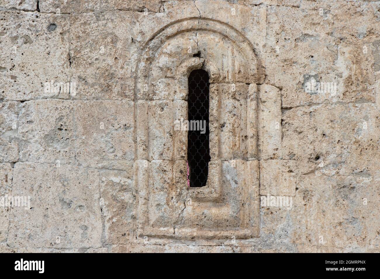 Window in the wall of an ancient Albanian temple in the village of Kish ...