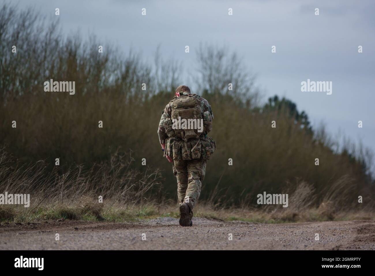 British army soldier completing an 8 mile combat training test tabbing ...