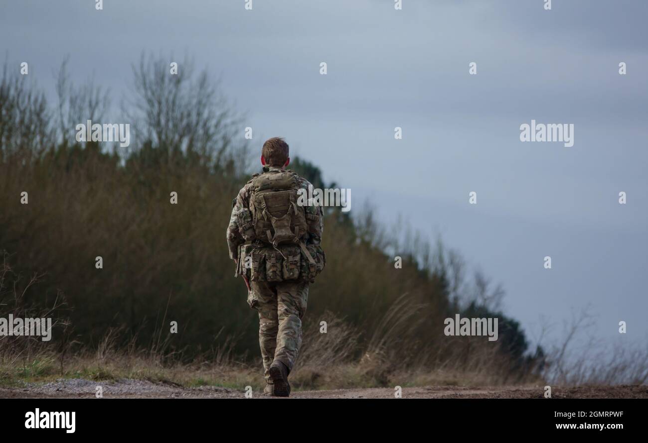 British army soldier completing an 8 mile combat training test tabbing ...