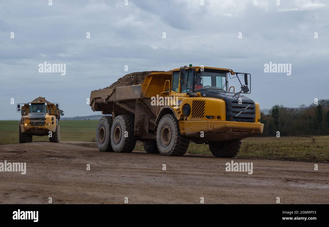 two yellow Volvo A40E articulated dump truck earth mover with 25 tonne ...