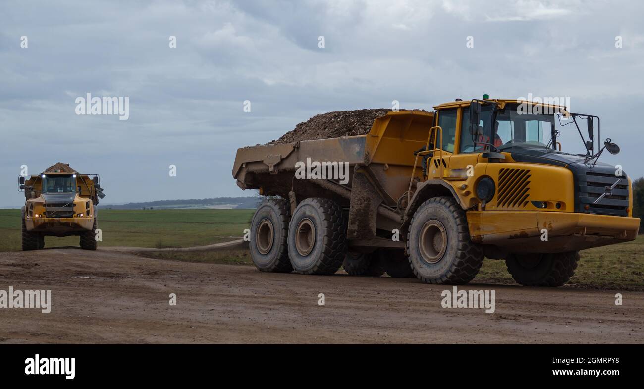 two yellow Volvo A40E articulated dump truck earth mover with 25 tonne ...