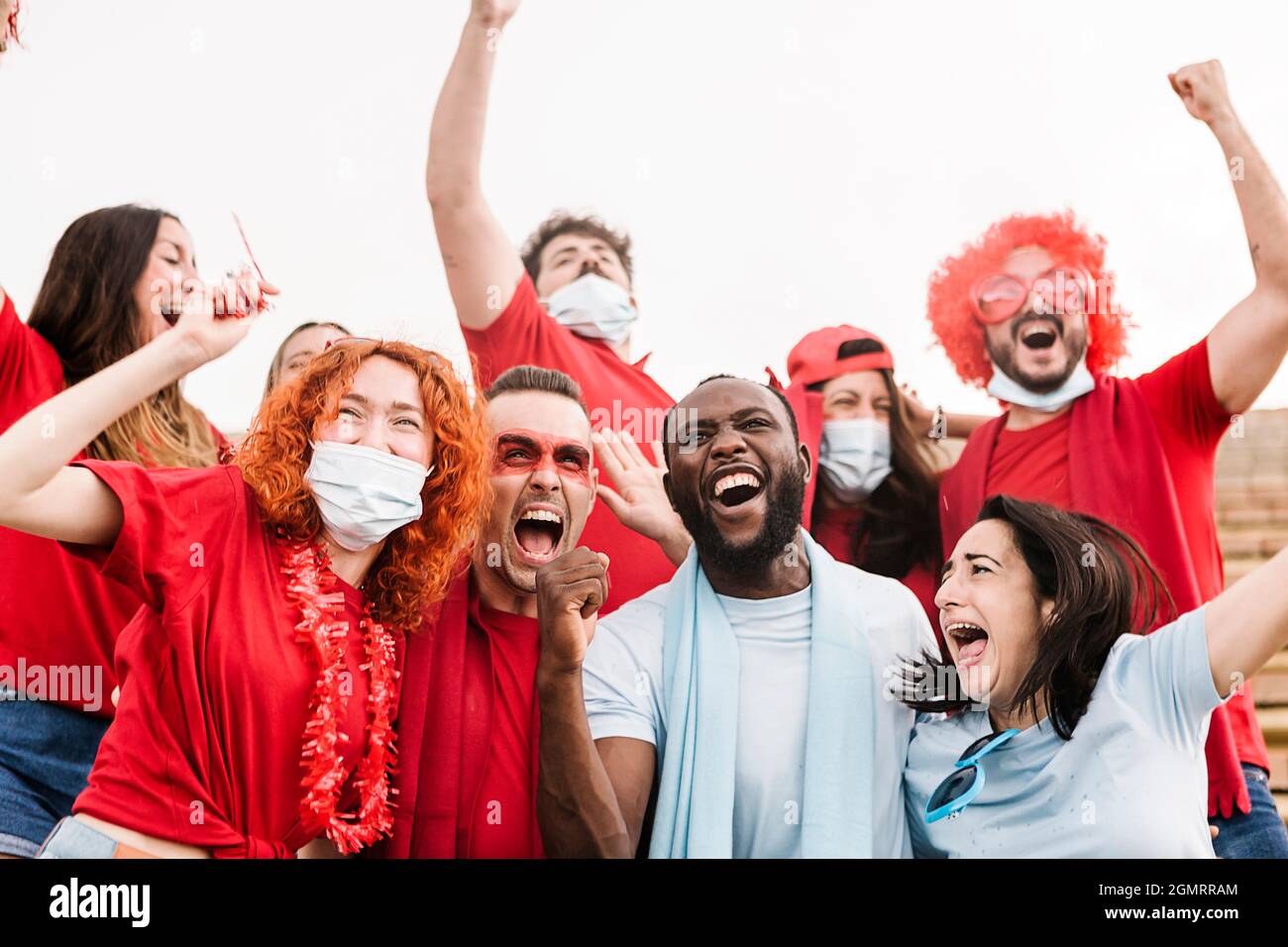 Group of happy multiracial football fans celebrating victory Stock ...
