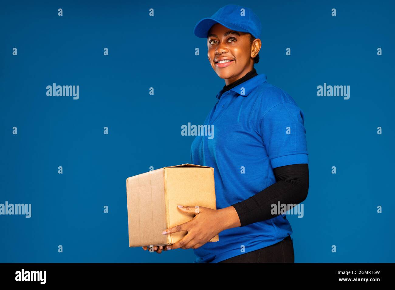 Young black female courier hi-res stock photography and images - Alamy