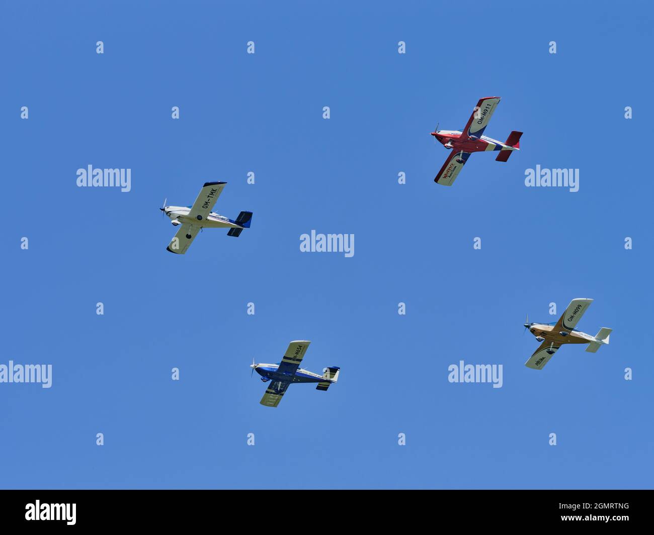 Light aerobatic aircrafts in close flight Stock Photo - Alamy
