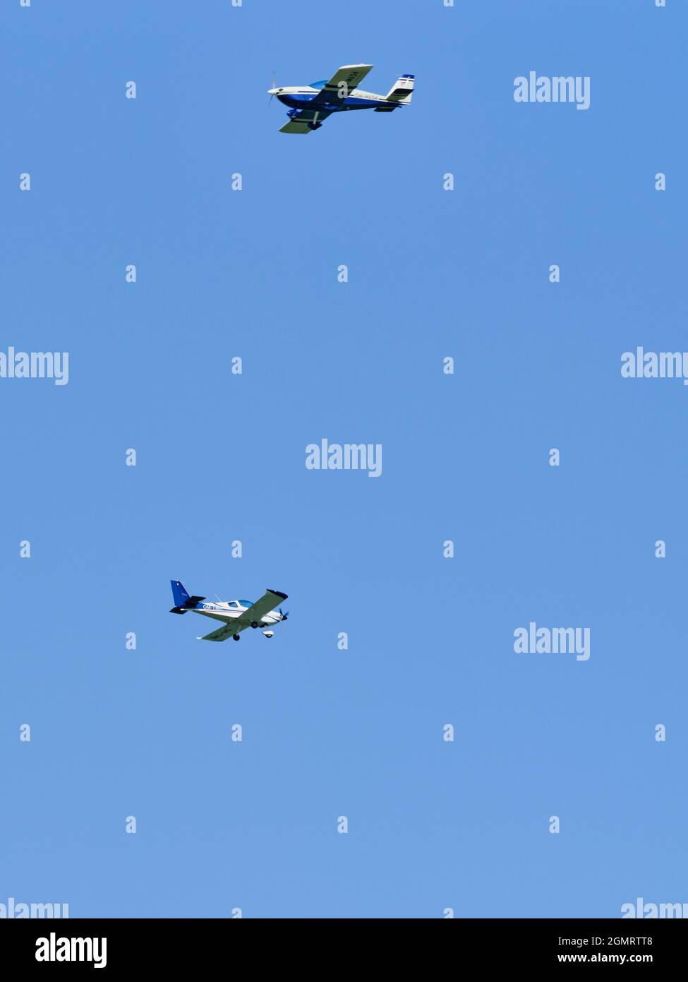 Light aerobatic aircrafts in close flight Stock Photo - Alamy