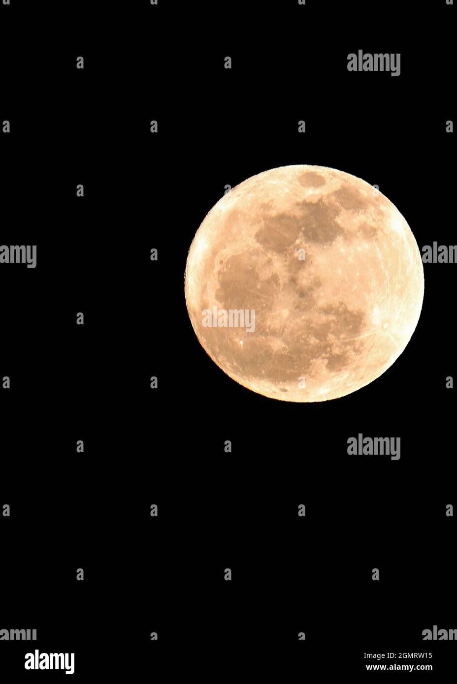 Vertical shot of a full moon in the dark sky Stock Photo - Alamy