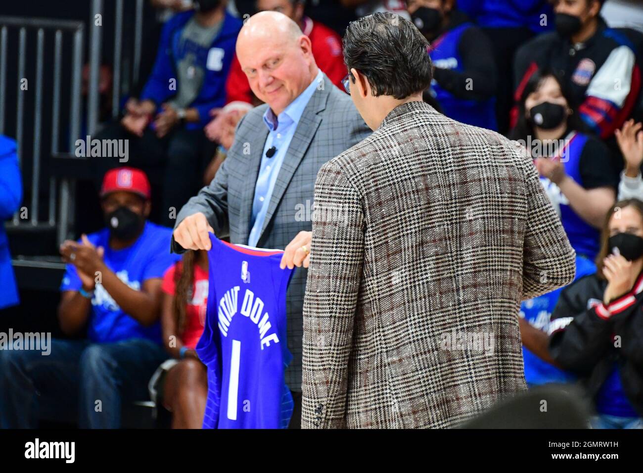 Intuit CEO Sasan Goodarzi is presented with a jersey during a ...