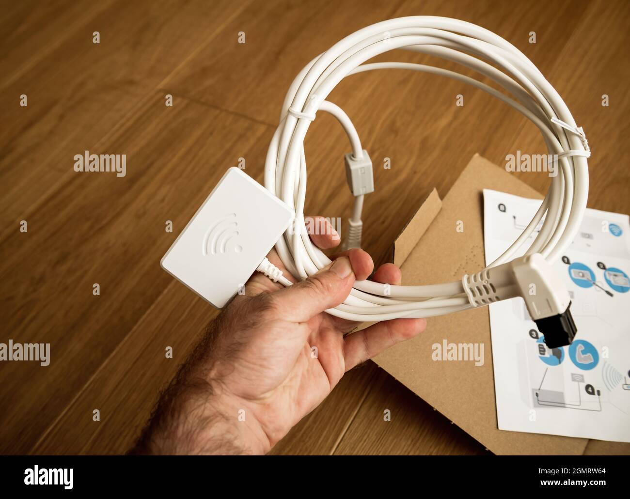 Personal perspective male hand holding new Wifi dongle Stock Photo - Alamy