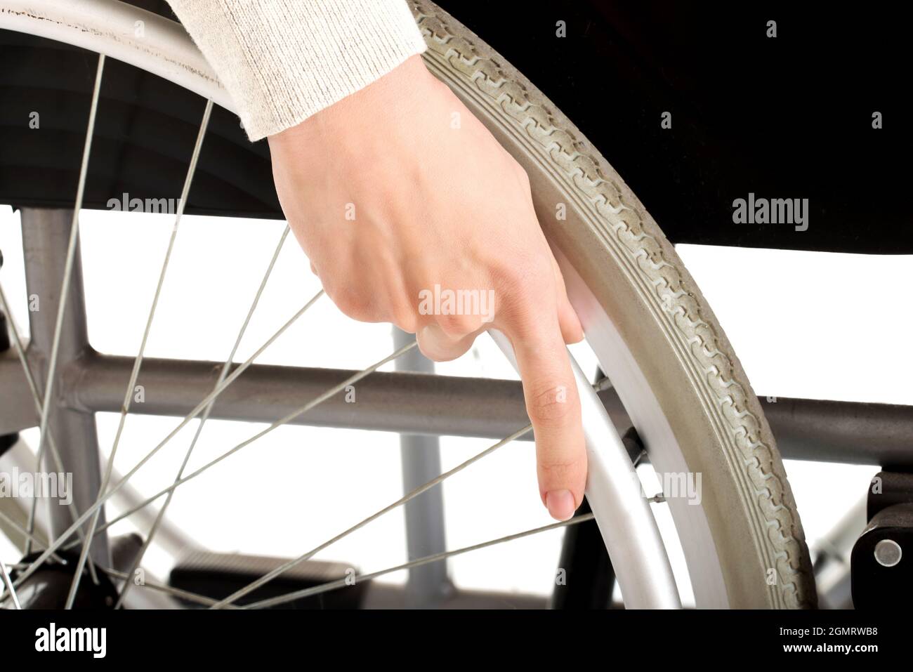 Closeup shot of a woman's hand holding the wheel of a wheelchair Stock ...