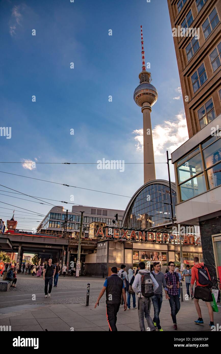 People walking at Alexanderplatz which is a large public square and ...