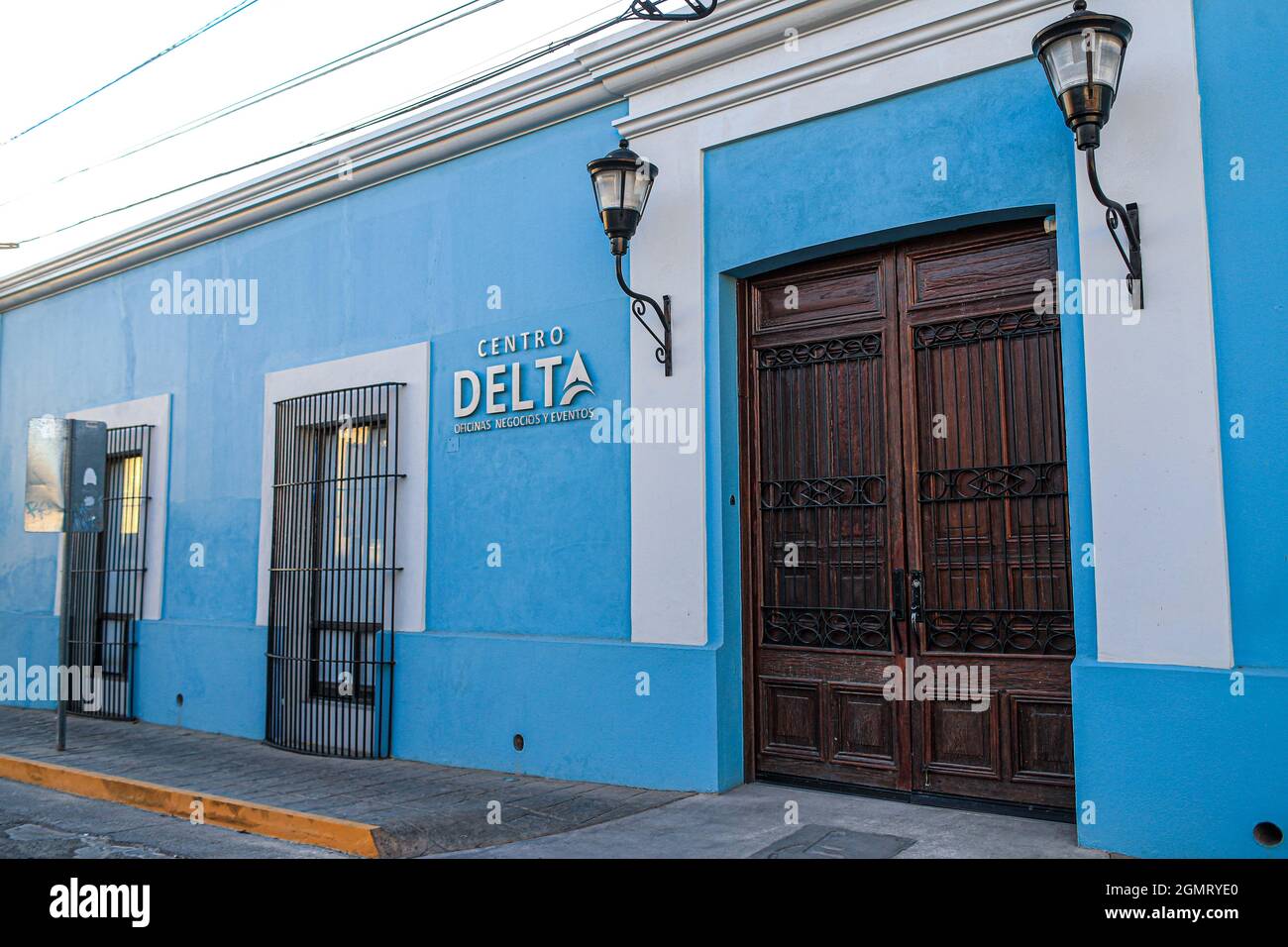 Facade of the blue building Centro Delta of the newspaper El Imparcial ...
