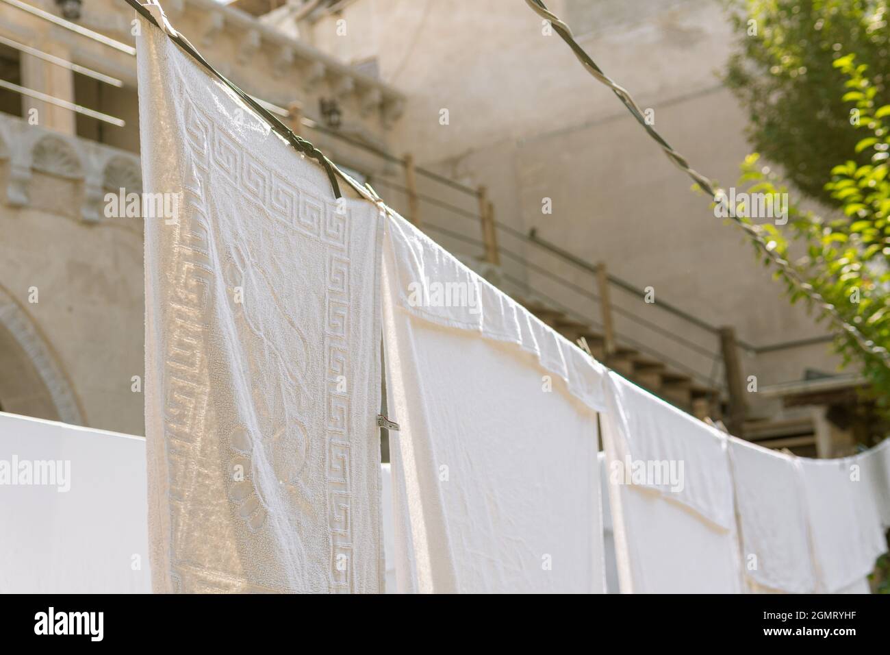 Hanging laundry, white laundry waiting to dry in a sunny weather Stock ...
