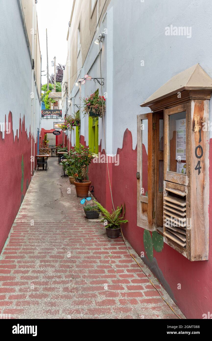 Colorful and Festive Alleyway Leading to a Restaurant Stock Photo - Alamy