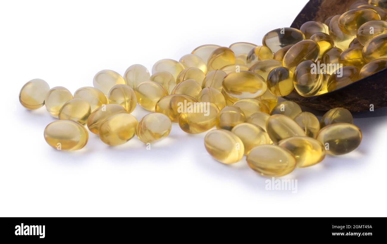 oil capsules, omega 3 and vitamin supplement with a natural cup ...