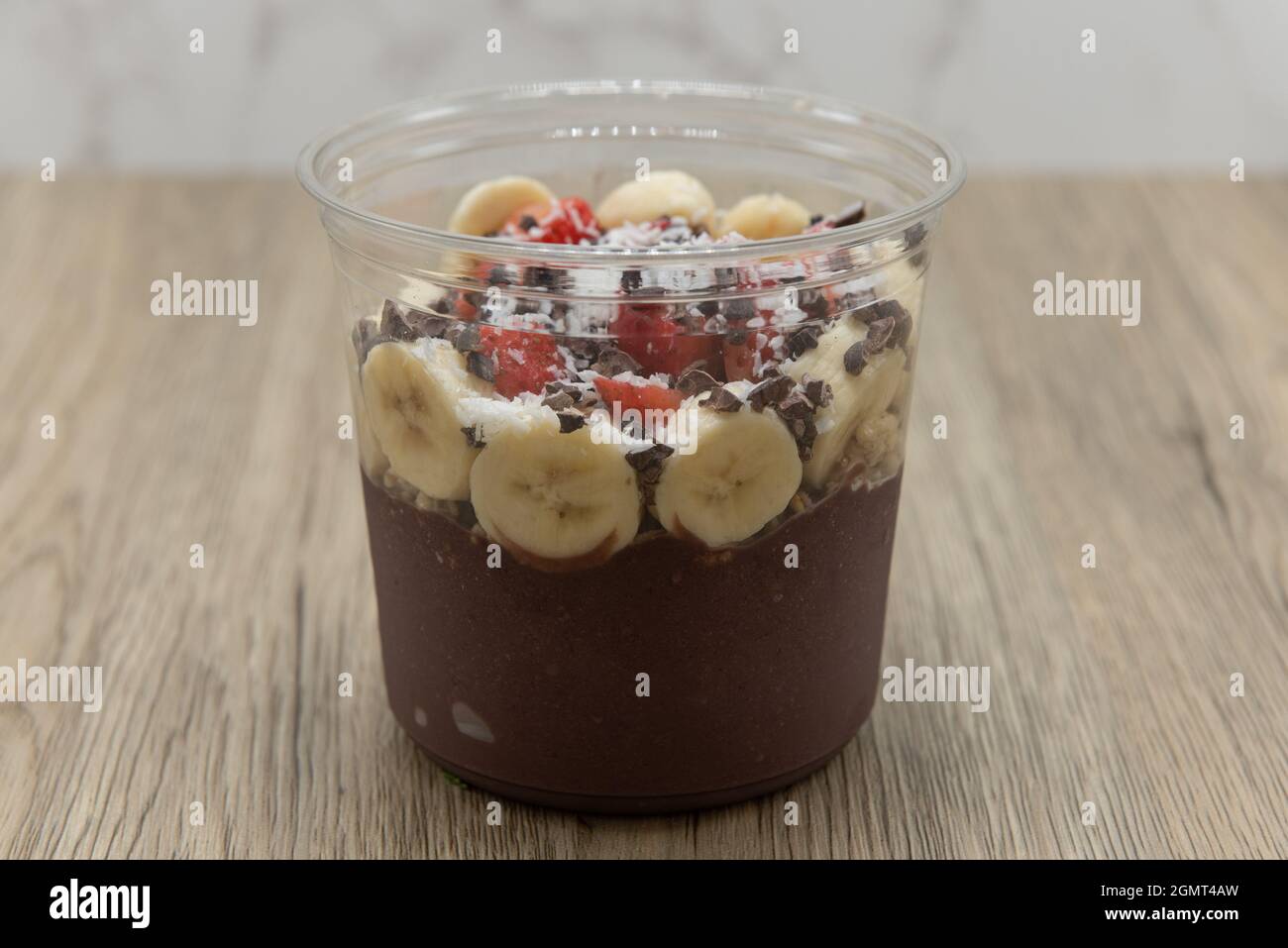 Acai fruit bowl coconut, cacao, and granola with blended flavors to ...