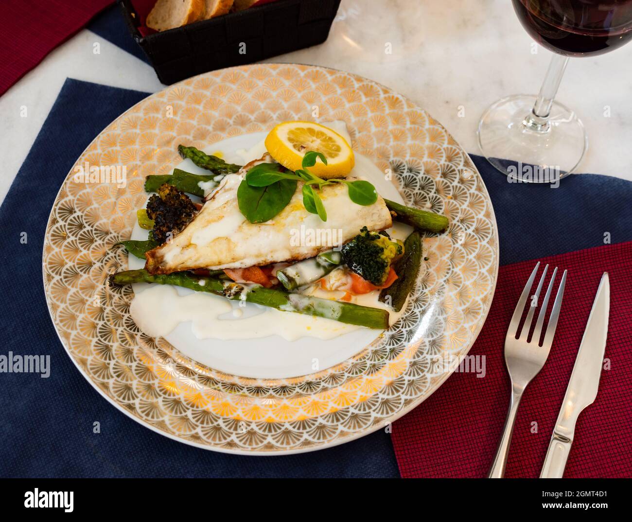 Fillet of sea bream with asparagus Stock Photo - Alamy