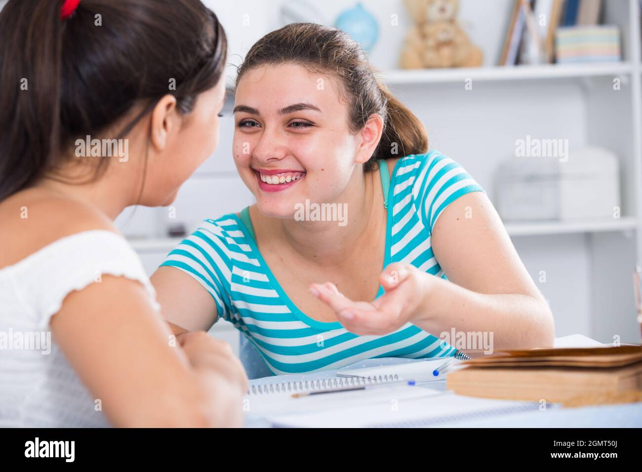 Two classmates doing homework together Stock Photo - Alamy