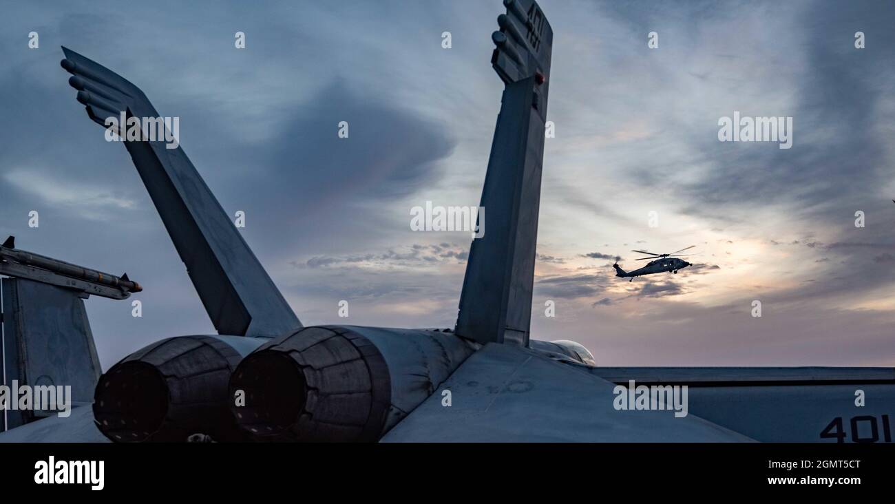 210919-N-RF825-1241 INDIAN OCEAN (Sept. 19, 2021) An MH-60S Seahawk ...