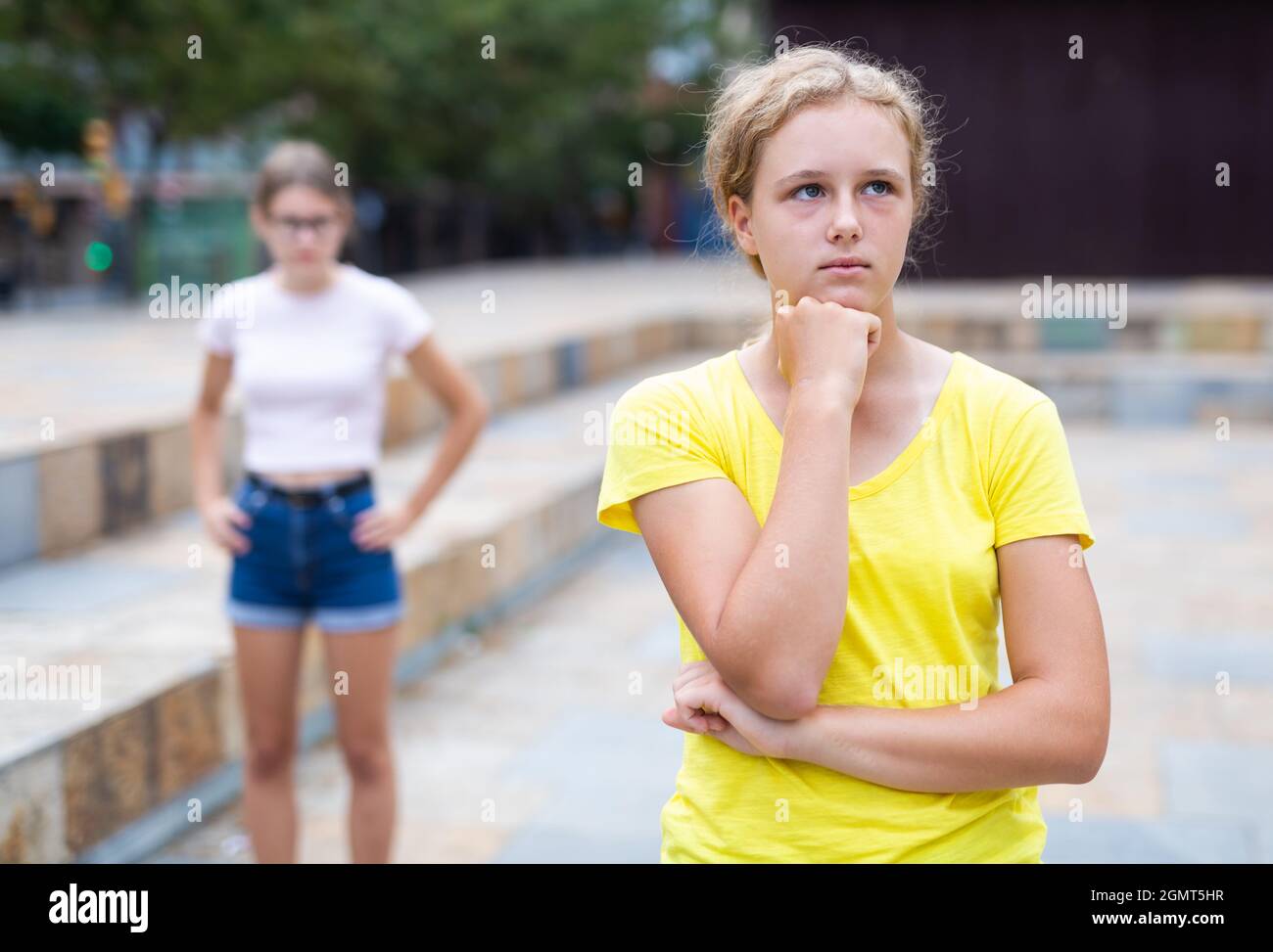 Youth girls quarreling between each other outdoors Stock Photo - Alamy