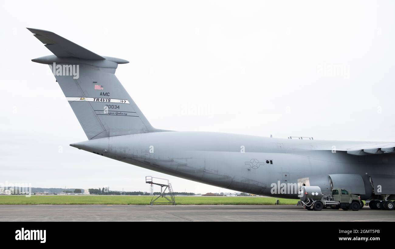 A 730th Air Mobility Squadron nitrogen servicing truck pulls up next to ...