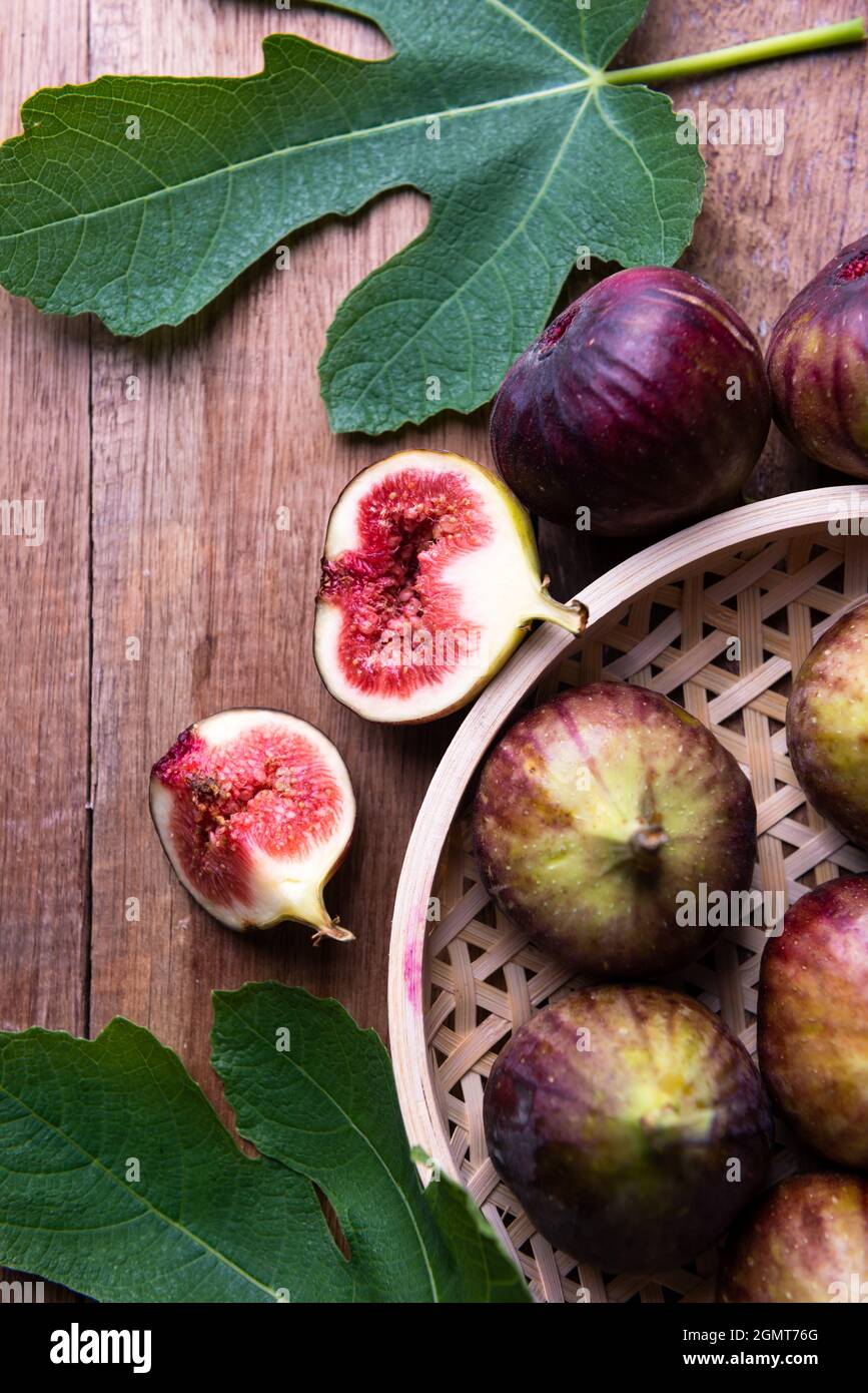 Figs, Tasty organic figs on wooden table Stock Photo - Alamy