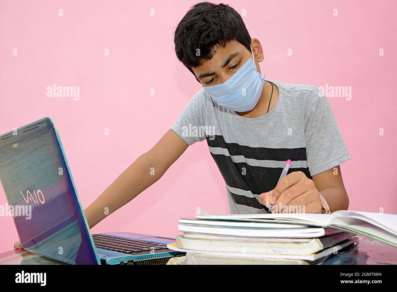 Using Laptop and studying in home Stock Photo - Alamy