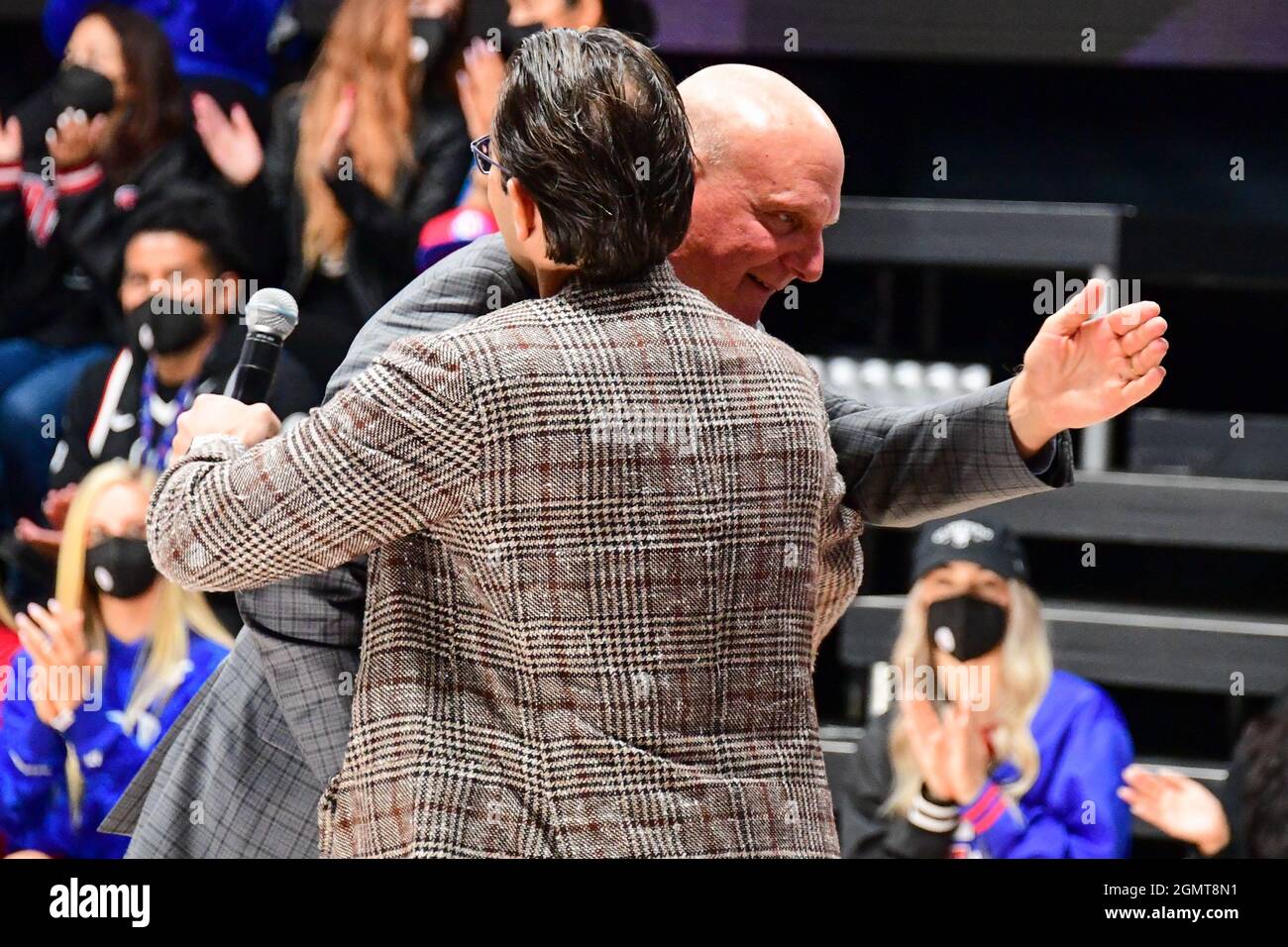 Intuit CEO Sasan Goodarzi hugs Los Angeles Clippers owner Steve Ballmer ...