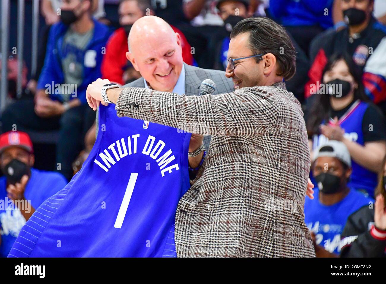Intuit CEO Sasan Goodarzi is presented with a jersey during a ...