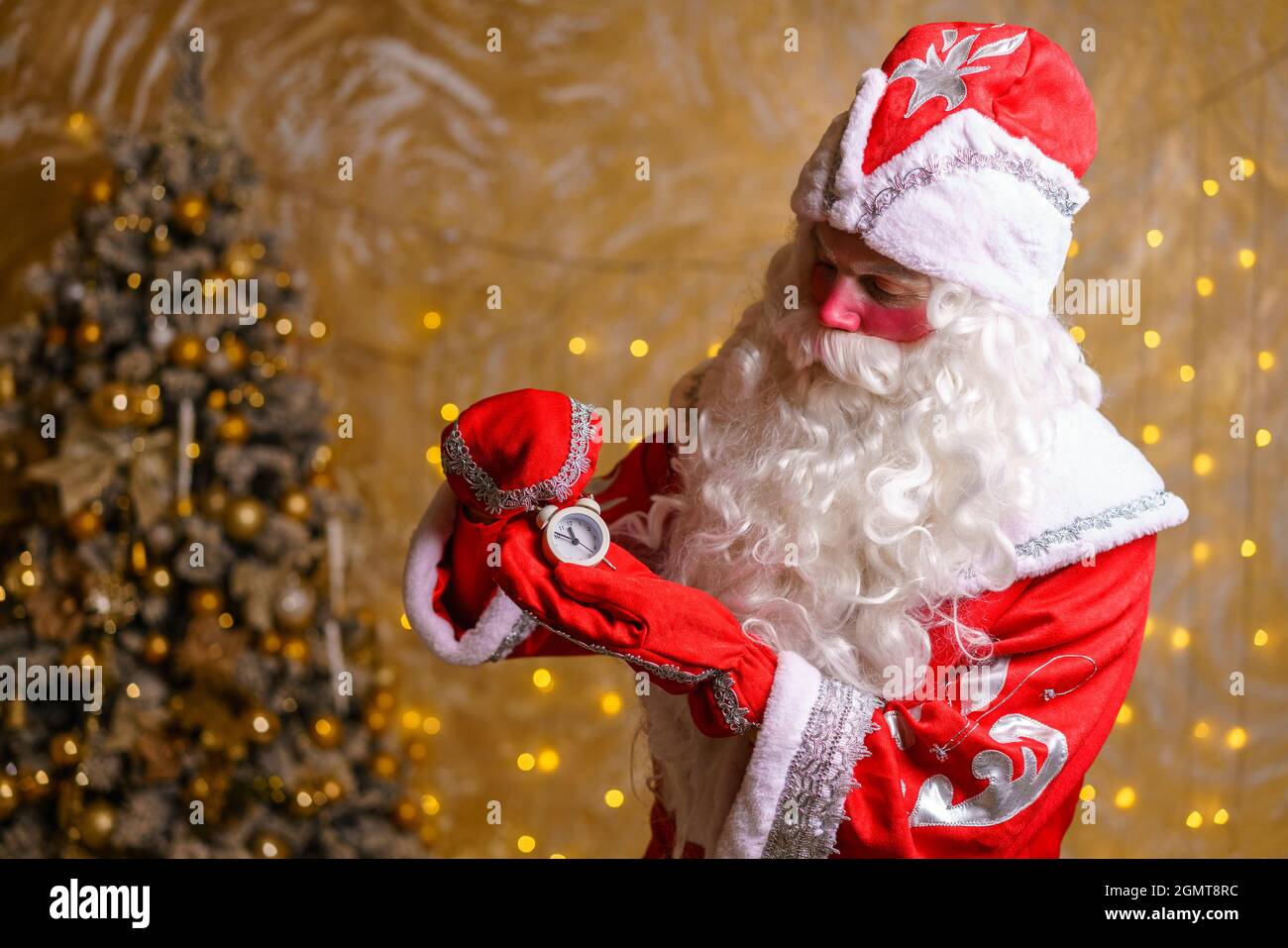 Happy santa with alarm clock showing five minutes to midnight ...