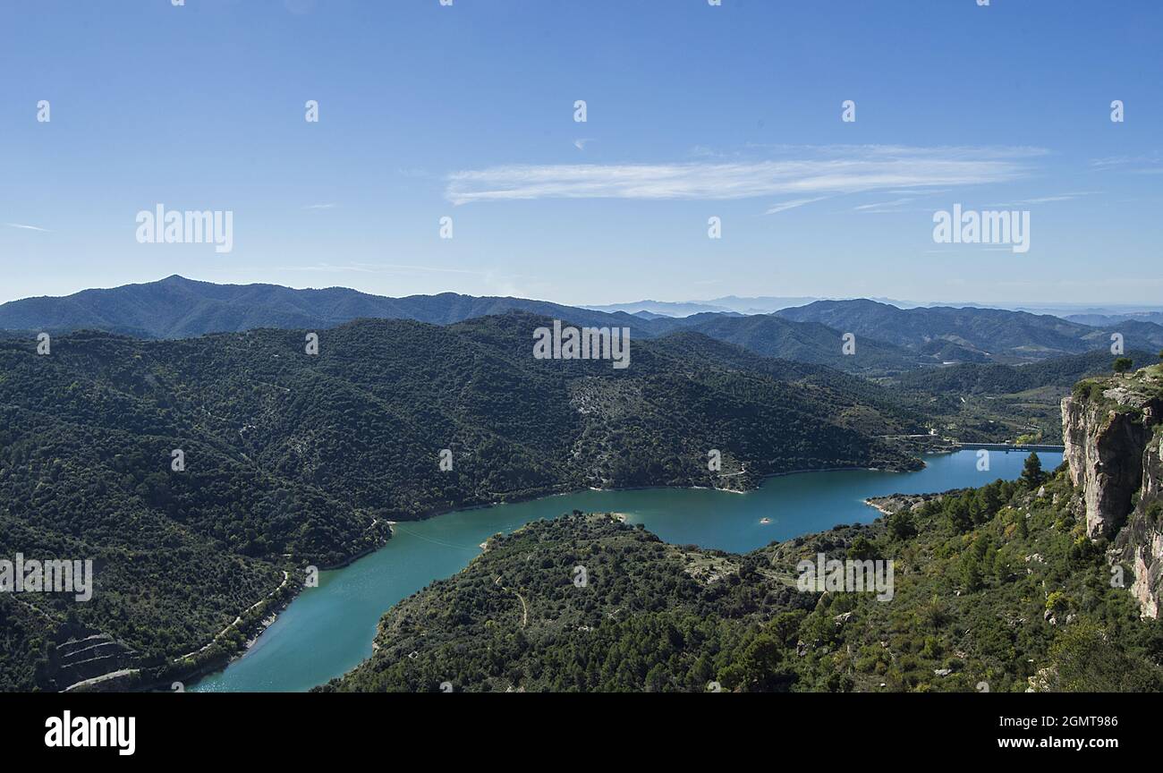 Natural view of a vast forest landscape and a lake under a clear blue sky Stock Photo - Alamy