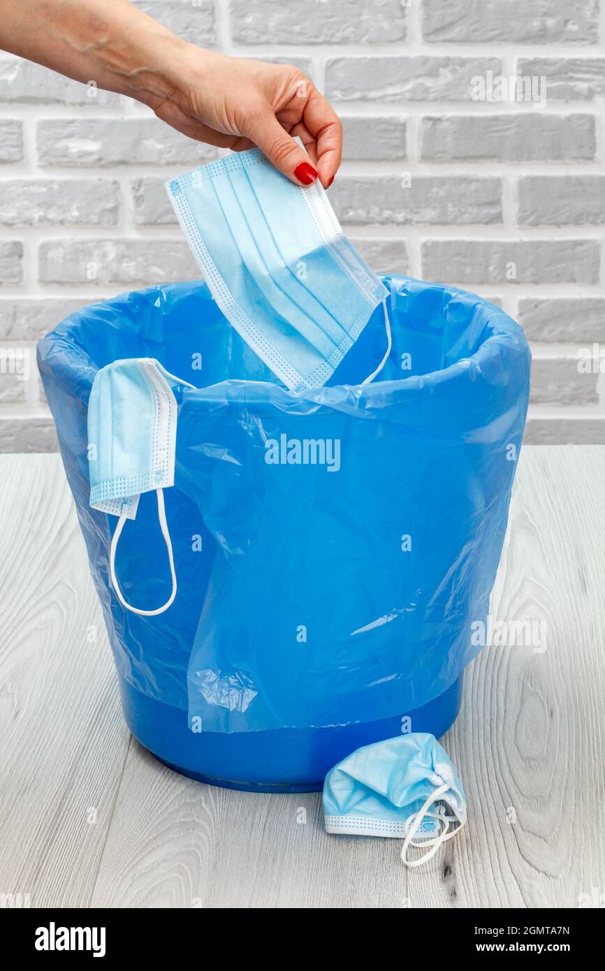 Used medical protective masks. The trash bin for utilization of ...