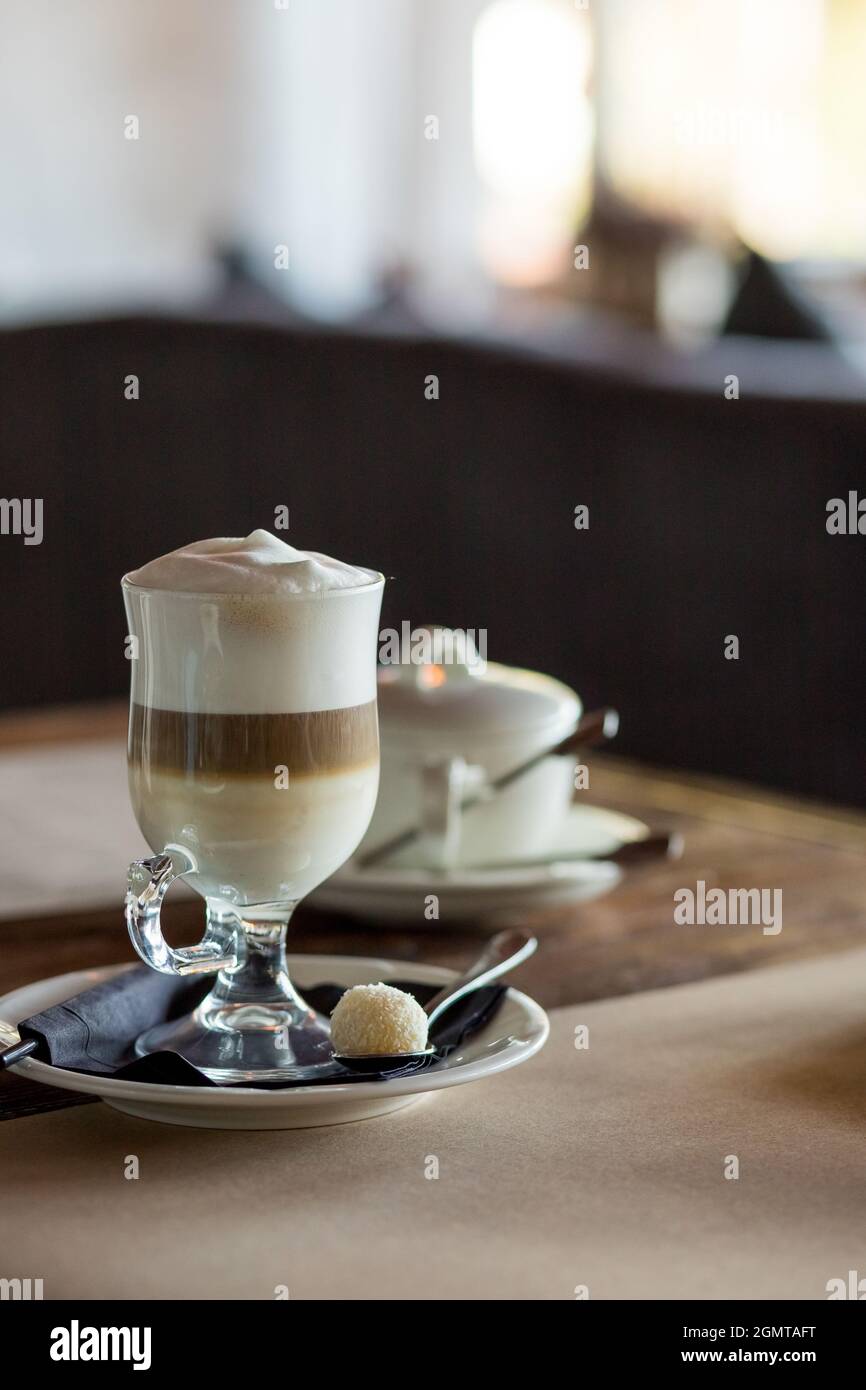 Peace of apricot cake with cup of latte macchiato Stock Photo - Alamy