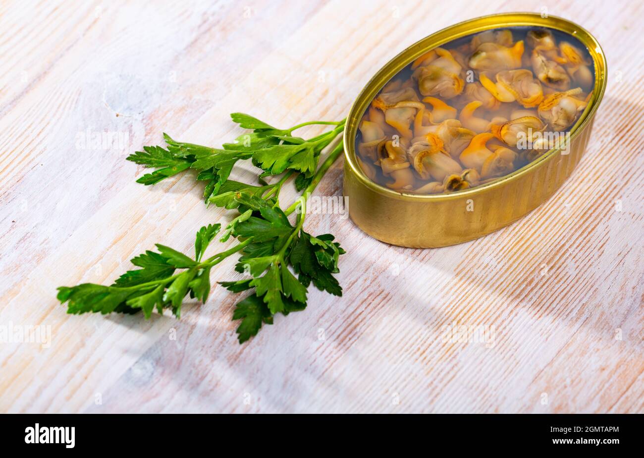 Canned mussels in oil on table Stock Photo - Alamy