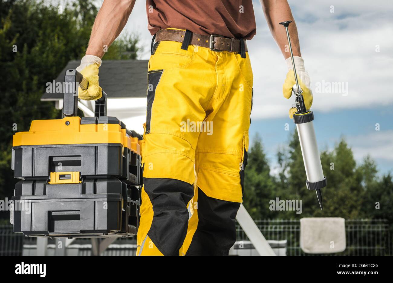 Caucasian Construction Worker with Silicon and Tools Box in His Hands ...