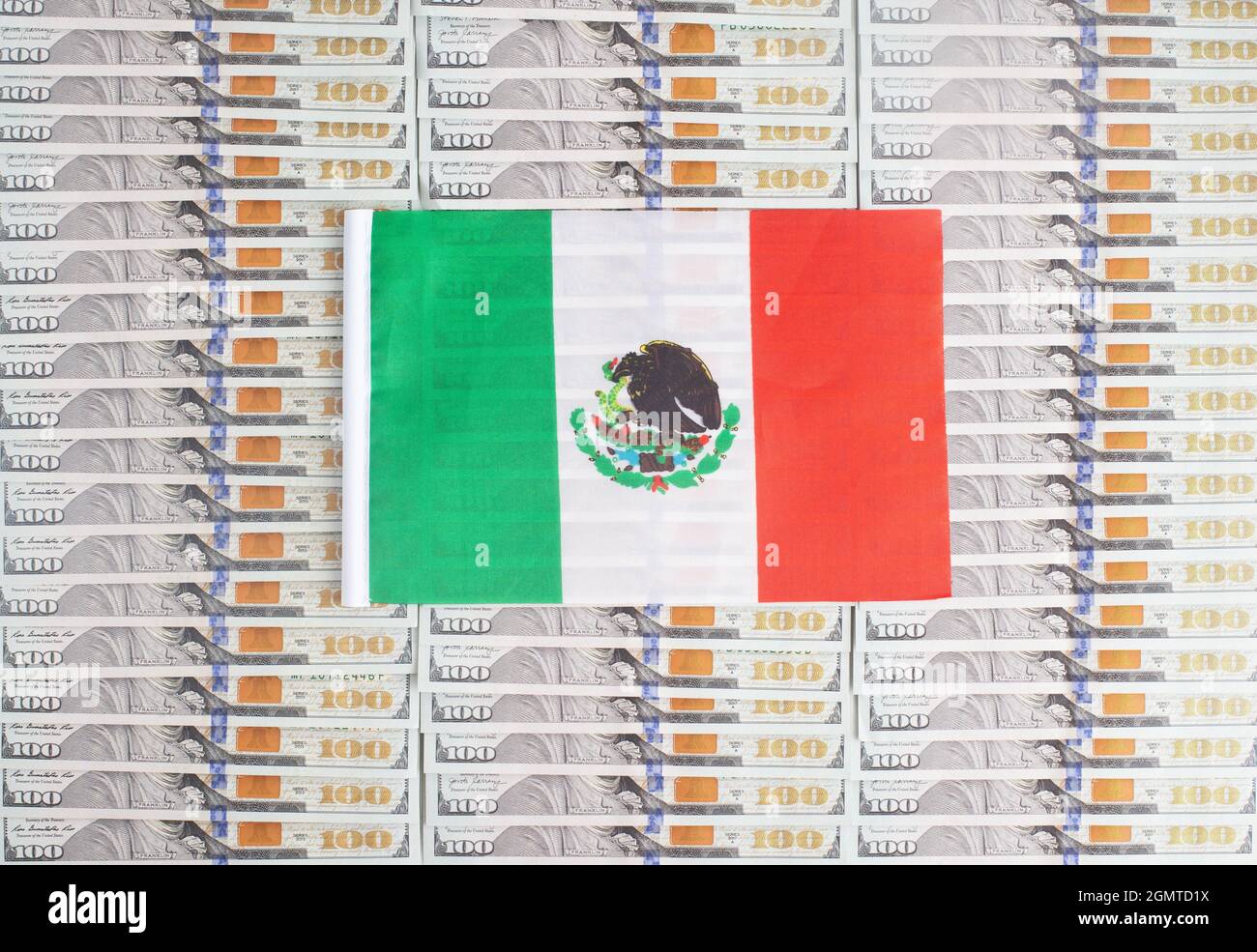 Mexico flag on a background from dollar banknotes. Concept of the ...