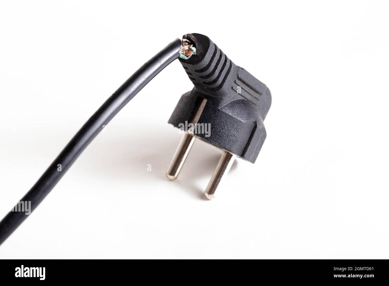Broken electrical wire with a plug on a white background, isolate ...