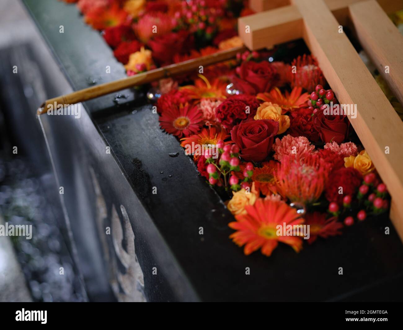 Water Ablution for Purification Filled by Flowers Stock Photo - Alamy