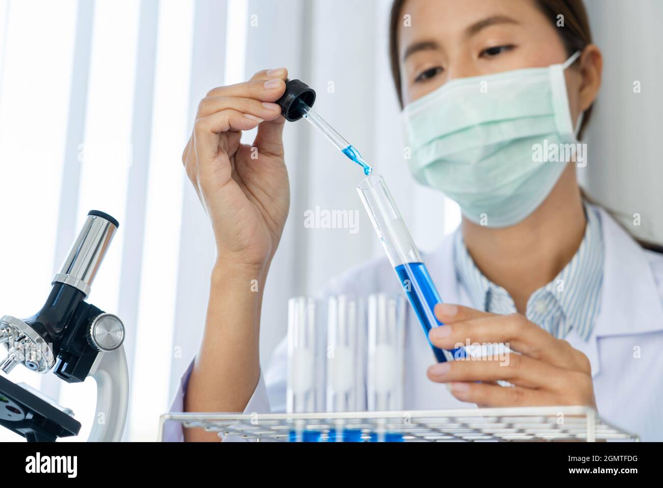 Scientist wear lab coat and protective wear are working with research ...