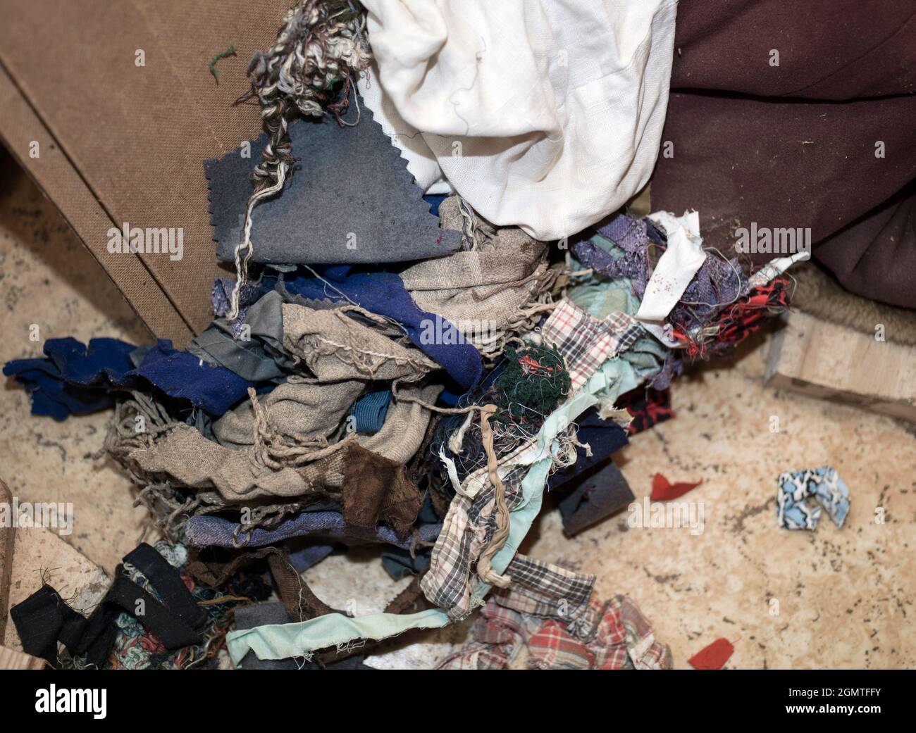 Heap of abandoned old clothes and rags, indoor shot Stock Photo - Alamy