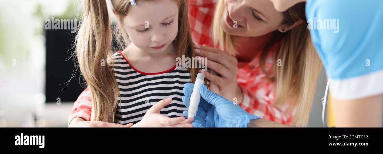 Little girl has doctor taking blood test with lancet Stock Photo - Alamy