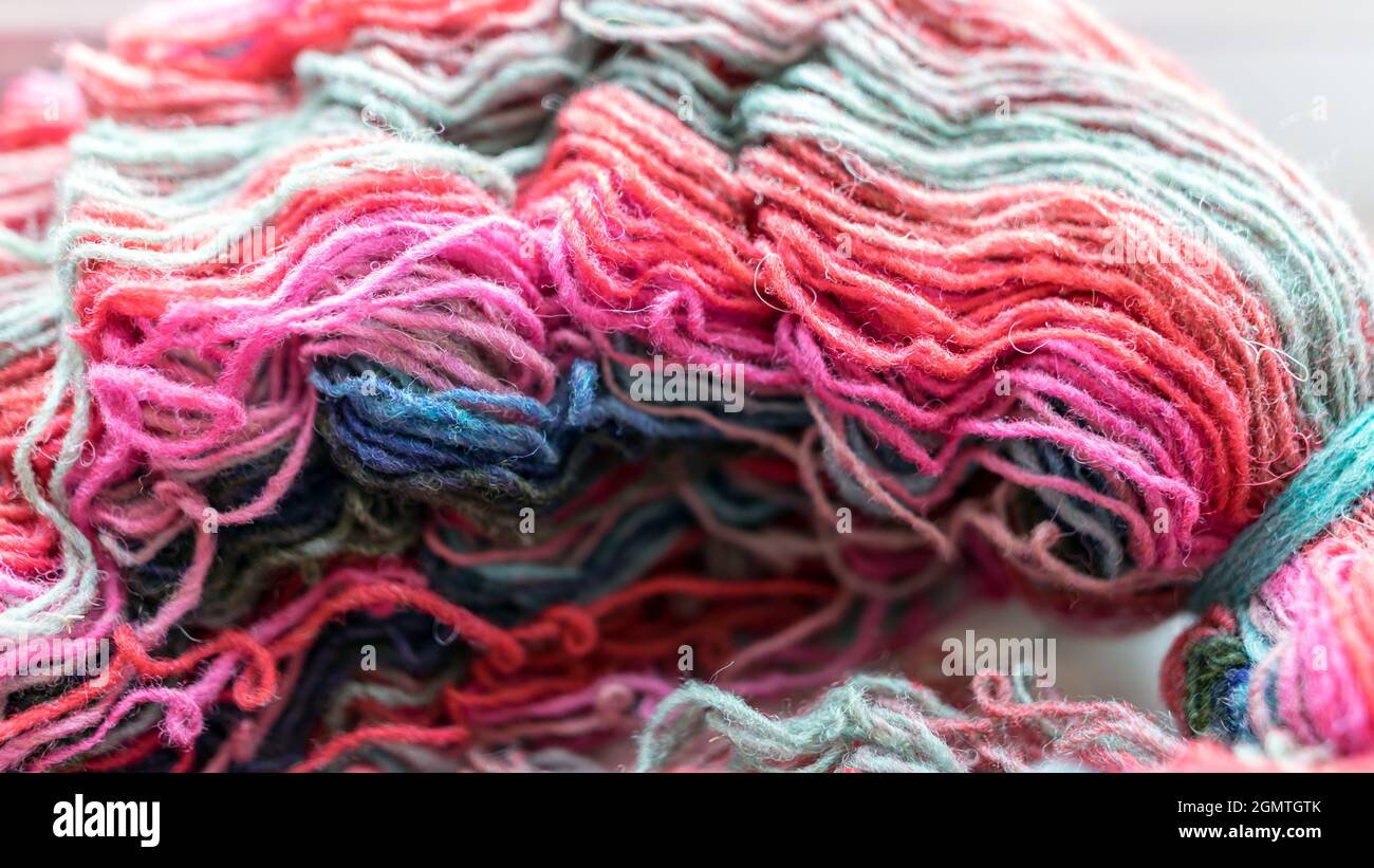 photography with colorful, variegated, bright wool yarn fragments ...