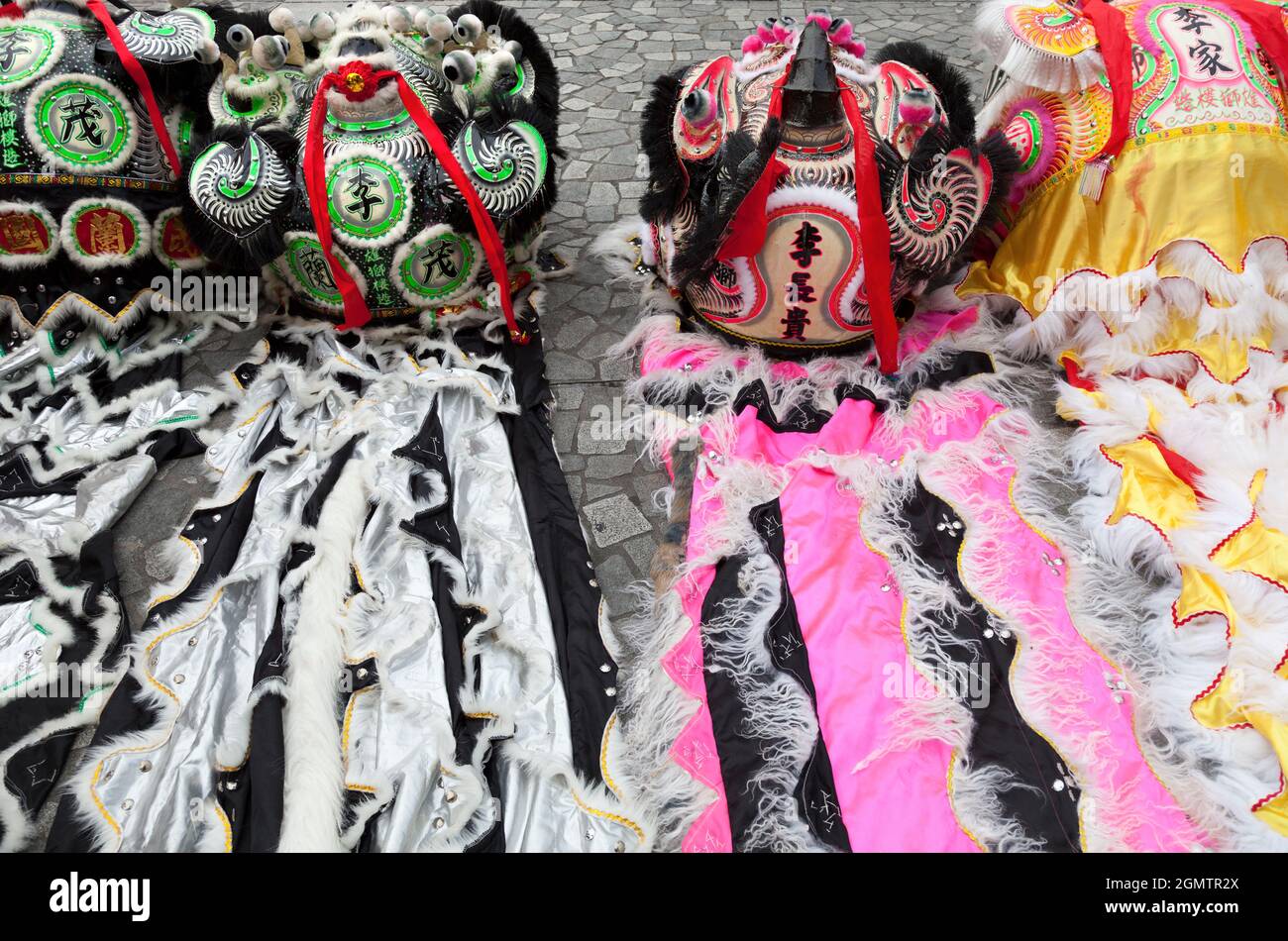 Hong Kong, 2018; Here we see Lion Dancing costumes on the pavement at ...