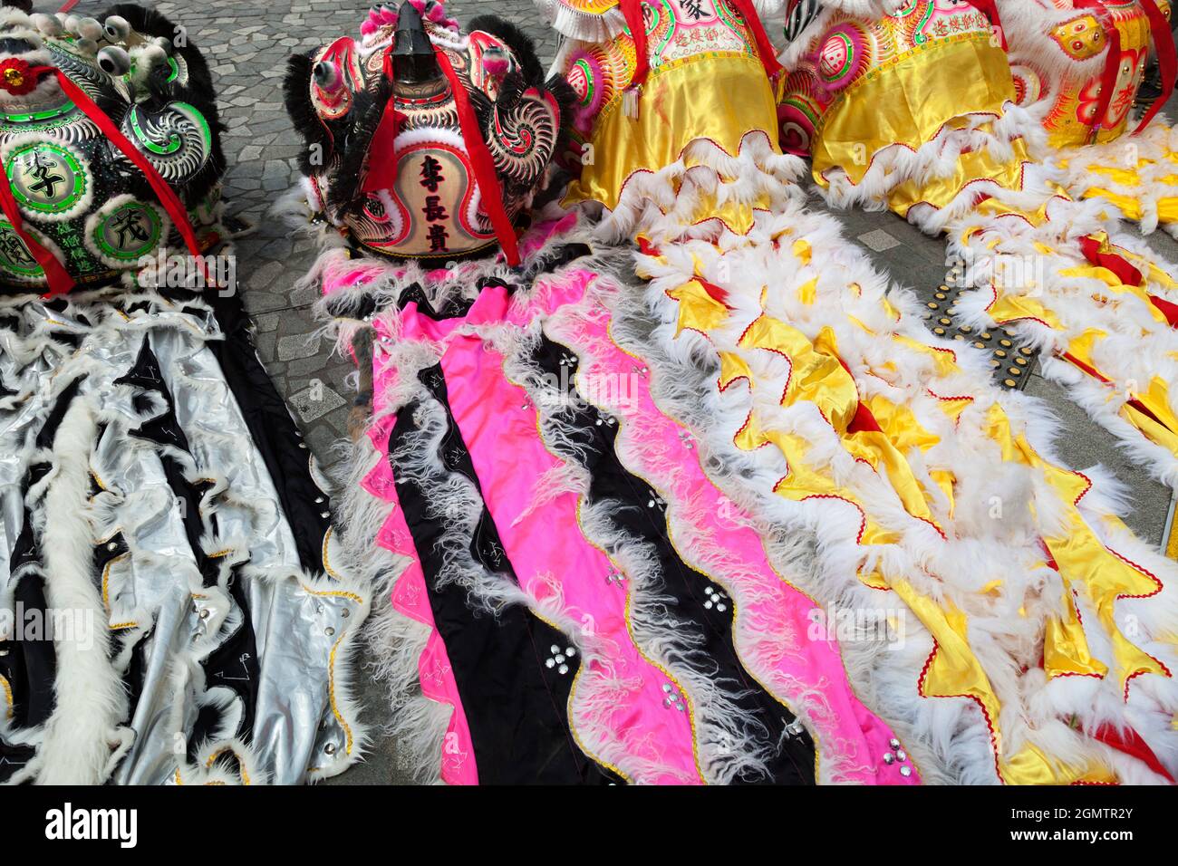 Hong Kong, 2018; Here we see Lion Dancing costumes on the pavement at ...