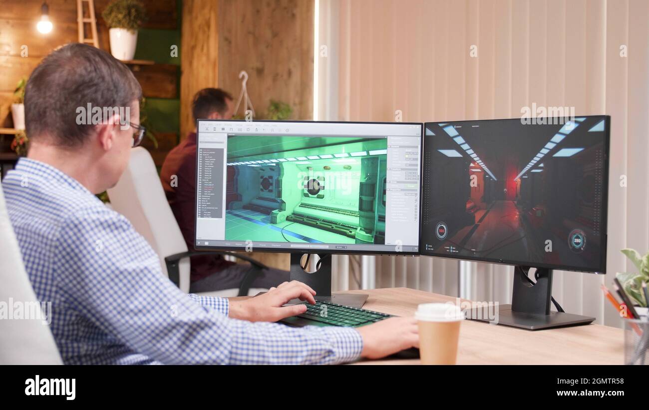 Game creator developing 3d videogame working at graphic ilustration in ...