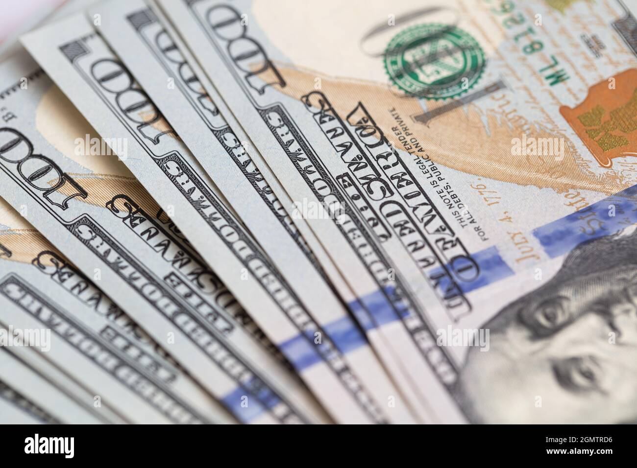 fan of 100 dollar banknotes on black glitter background Stock Photo - Alamy