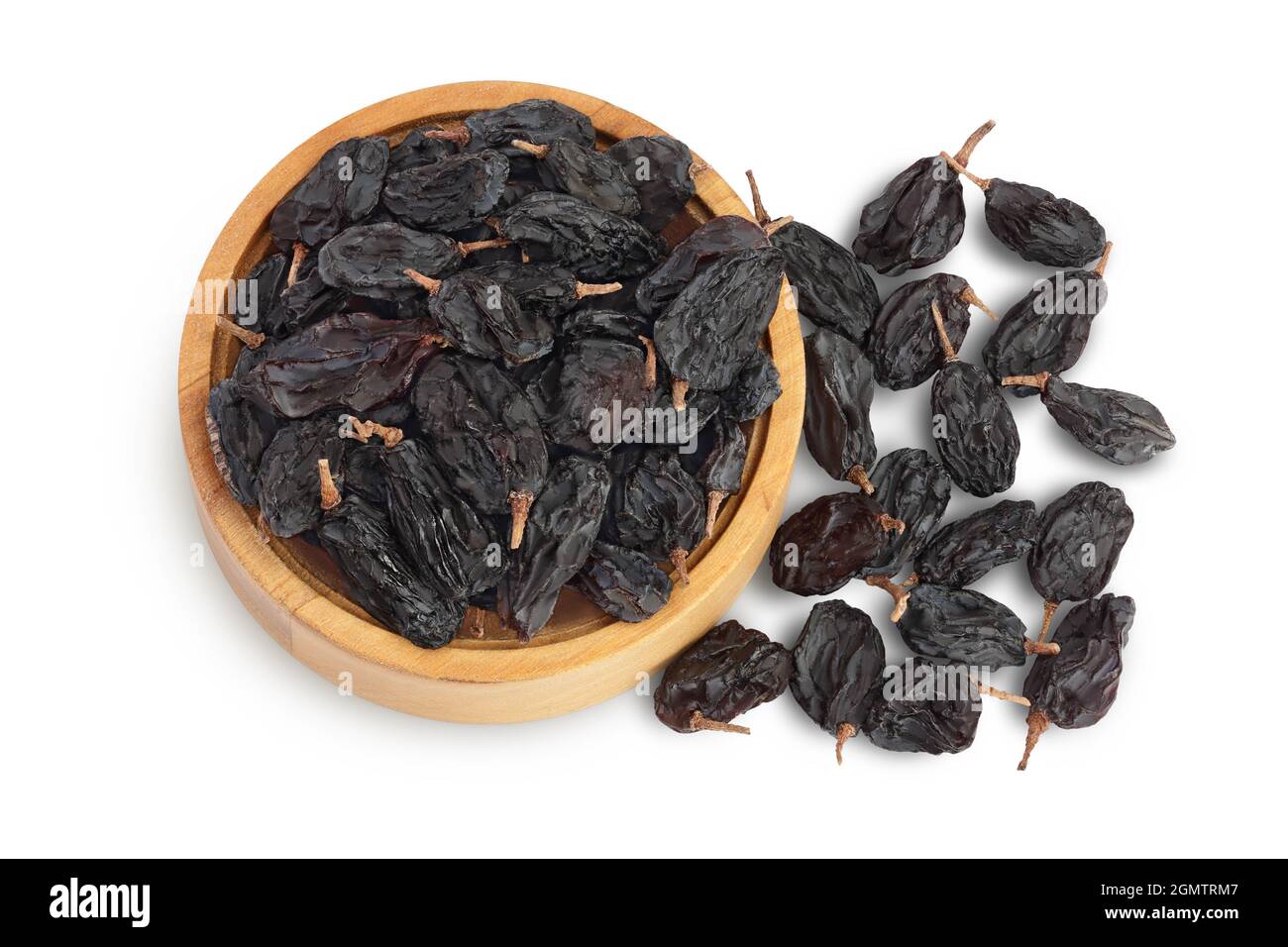 Black raisin iin wooden bowl solated on white background with clipping ...