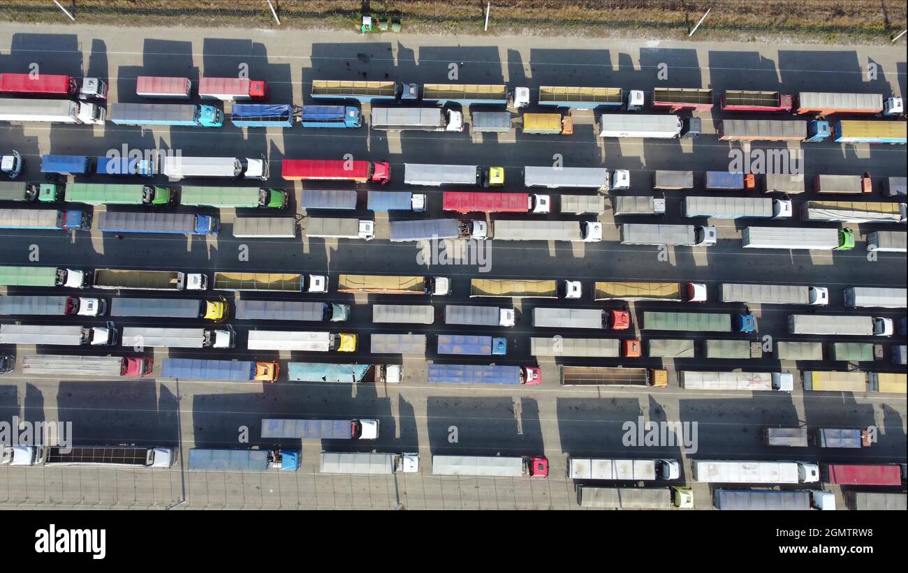 Trucks in the parking lot from a bird's eye view. Top view of a queue ...